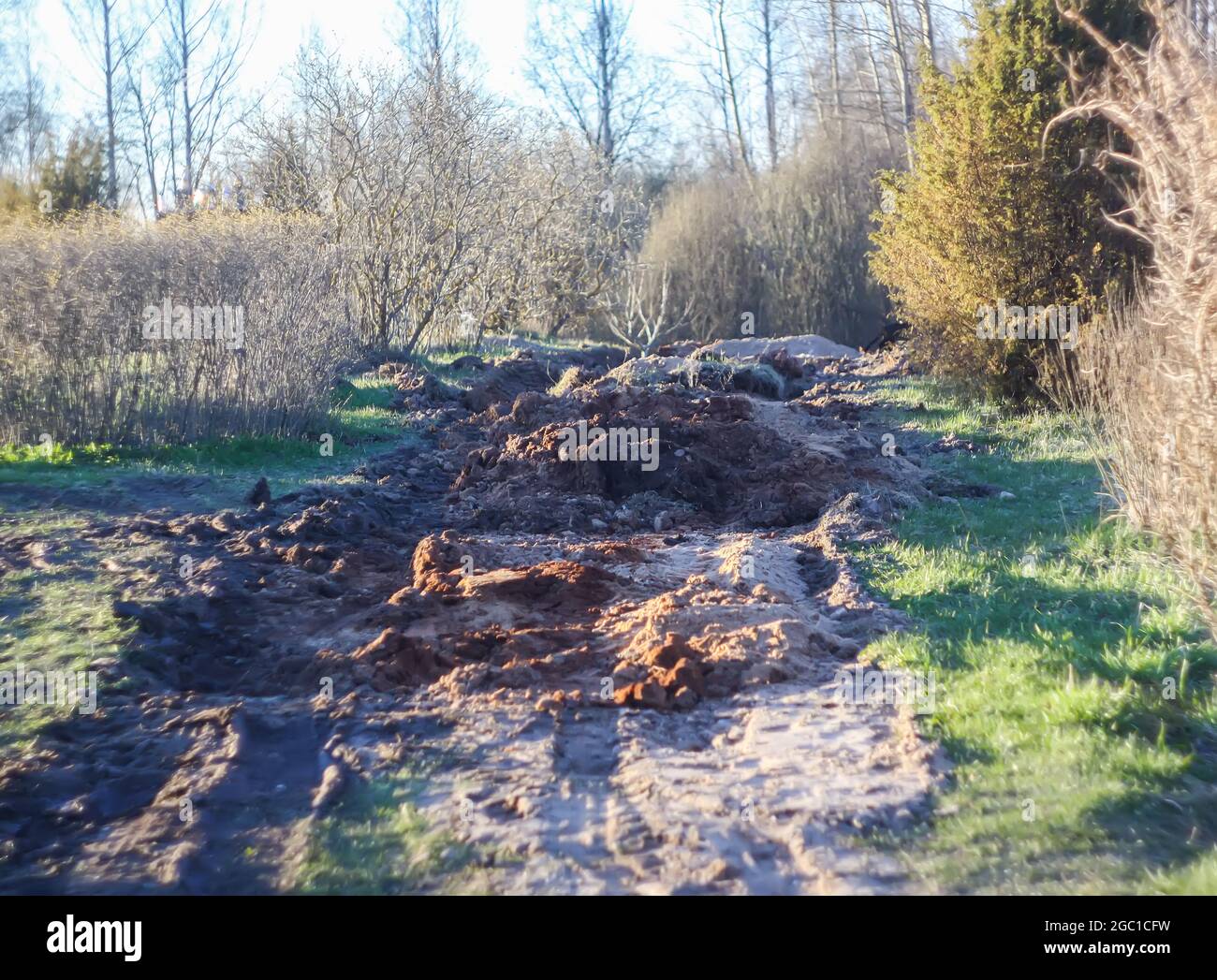 Dirty impassable road in countryside at spring Stock Photo - Alamy
