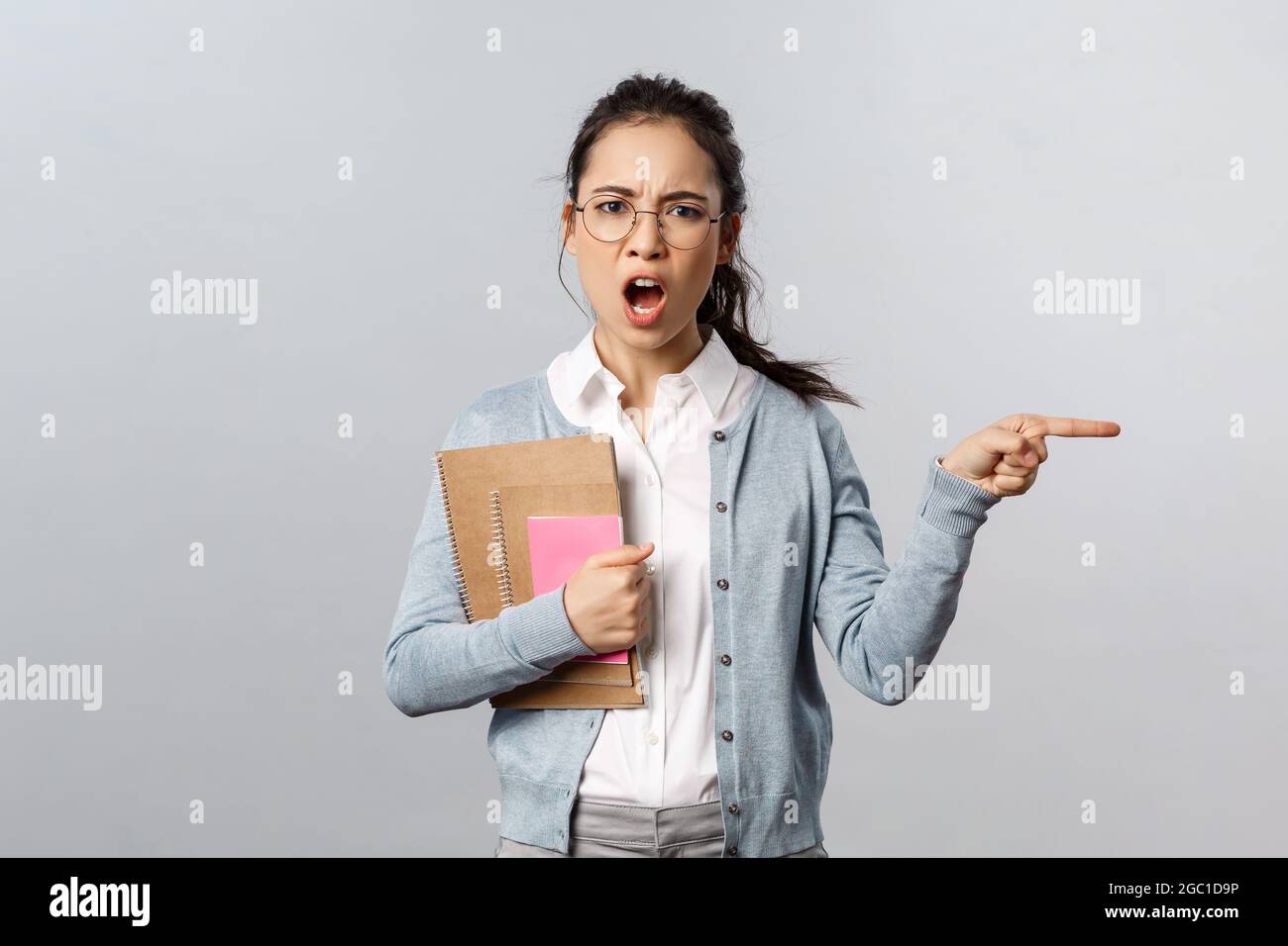 Education, teachers, university and schools concept. Angry and ...