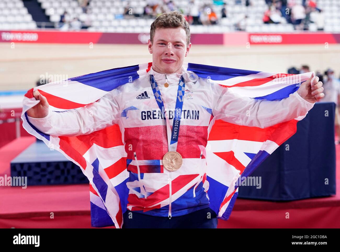 Great Britain's Jack Carlin celebrates on the podium with the bronze ...
