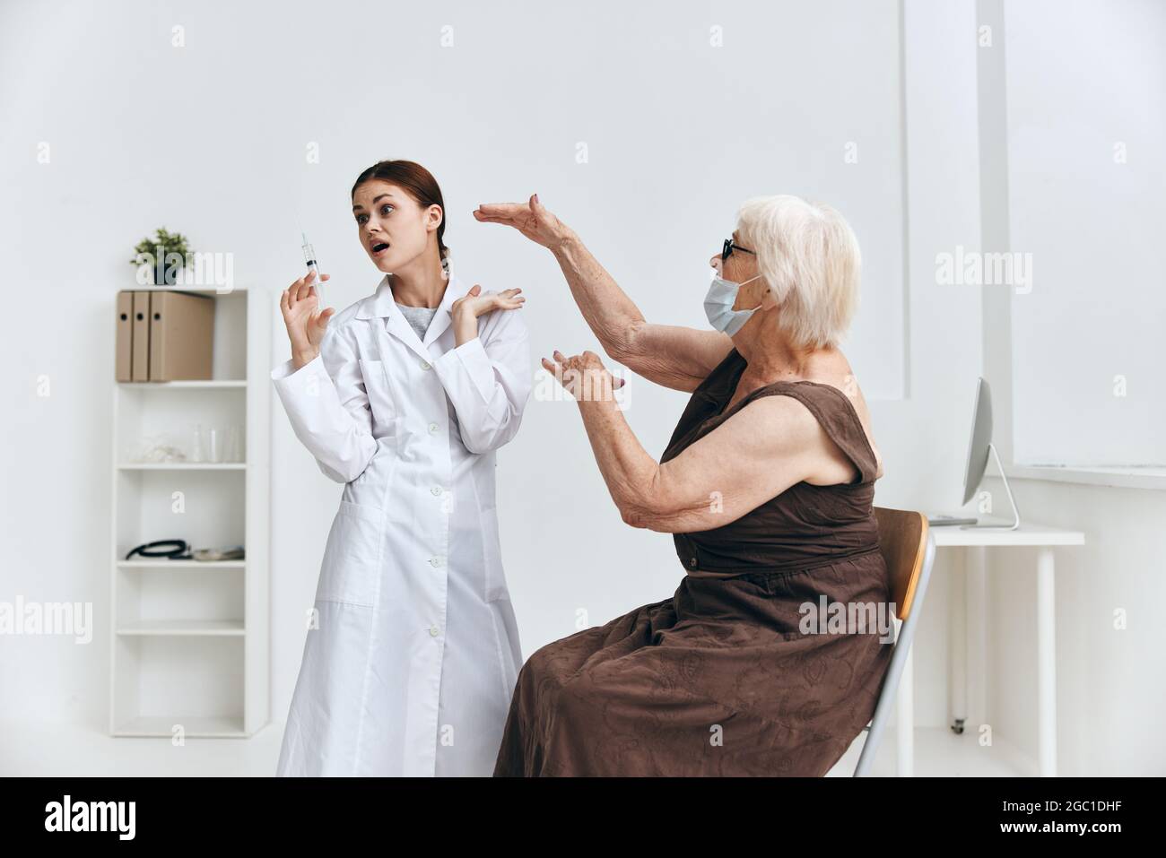 nurse and patient syringe injection immunity protection Stock Photo - Alamy