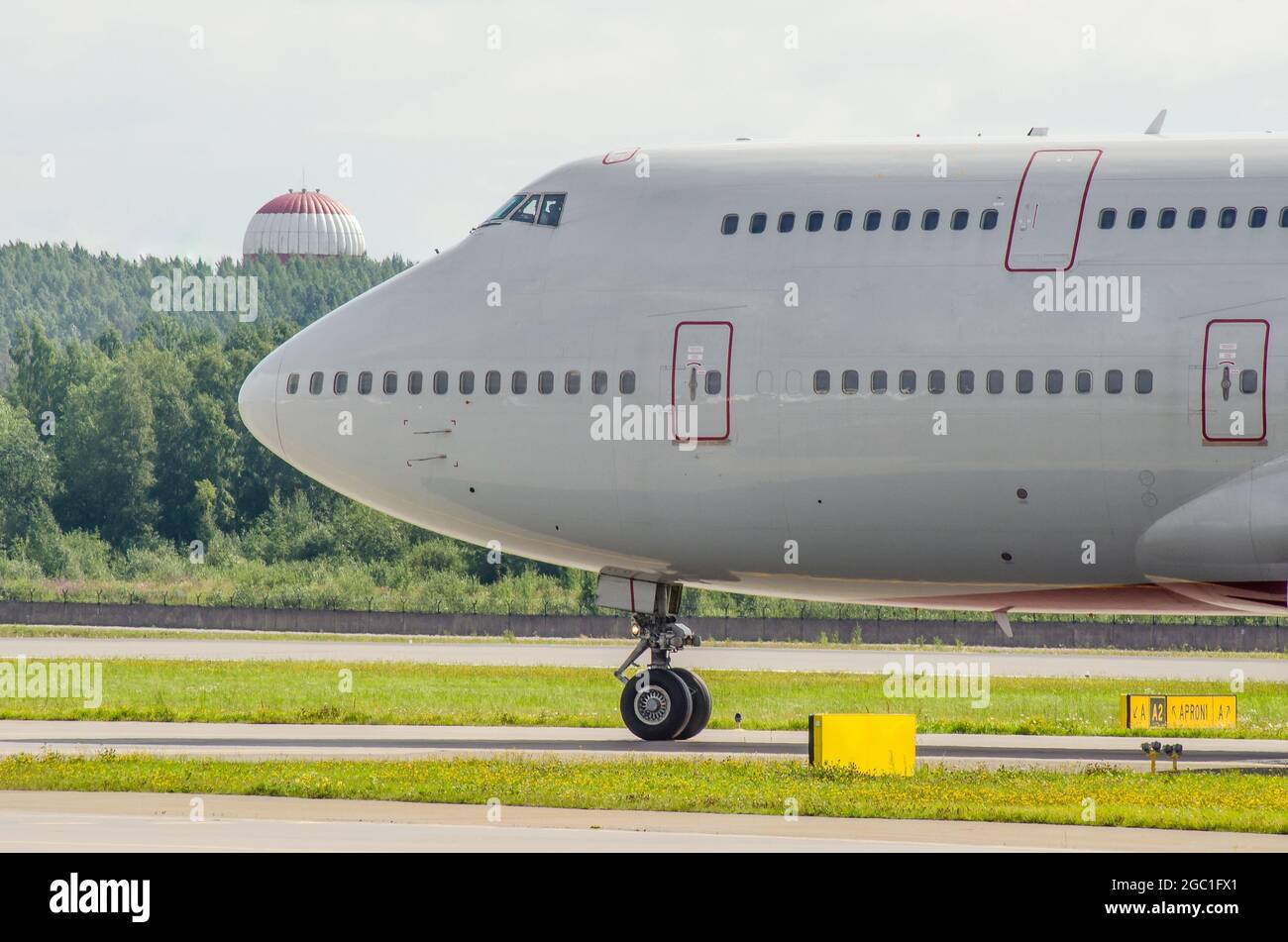 Nose cockpit pilot of a two-story airplane on the runway at the airport ...