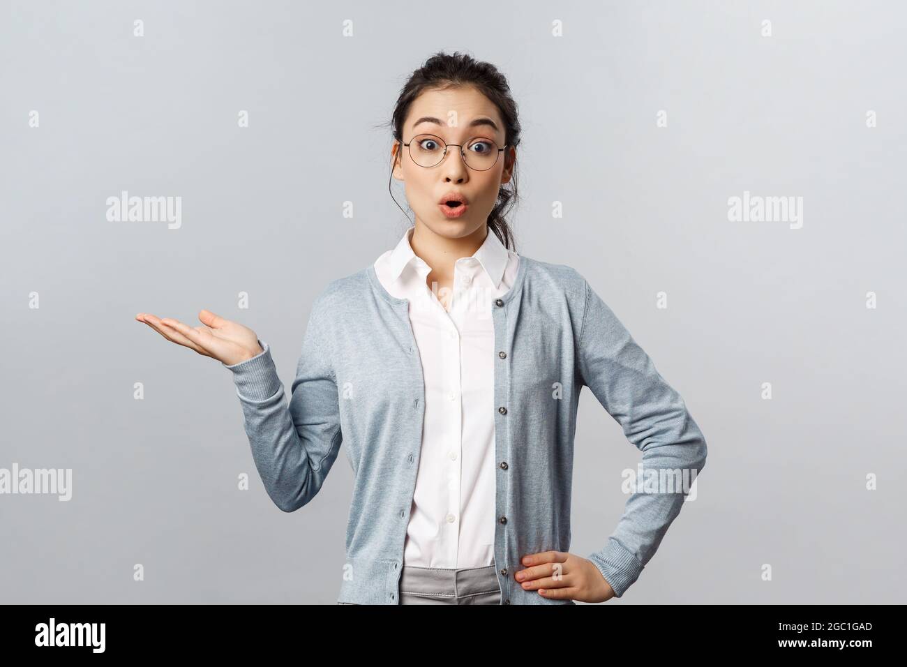 Lifestyle, people and emotions concept. Intrigued and surprised asian ...