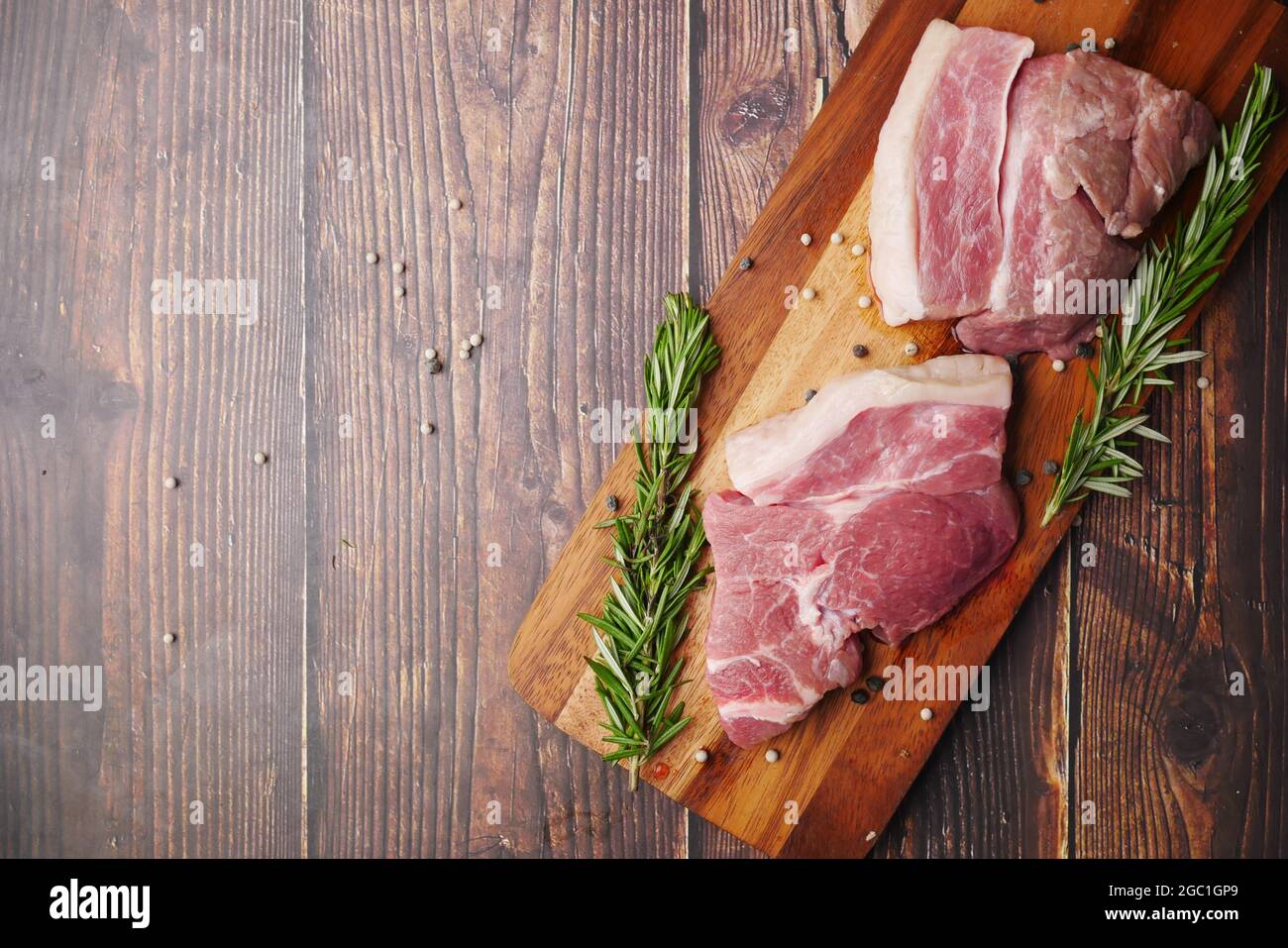 raw meat on chopping board on a chopping board Stock Photo - Alamy