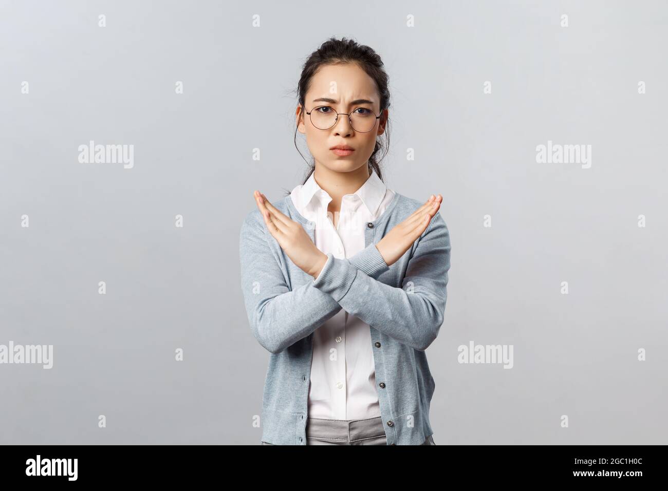 We must end it. Serious-looking determined young confident asian woman ...