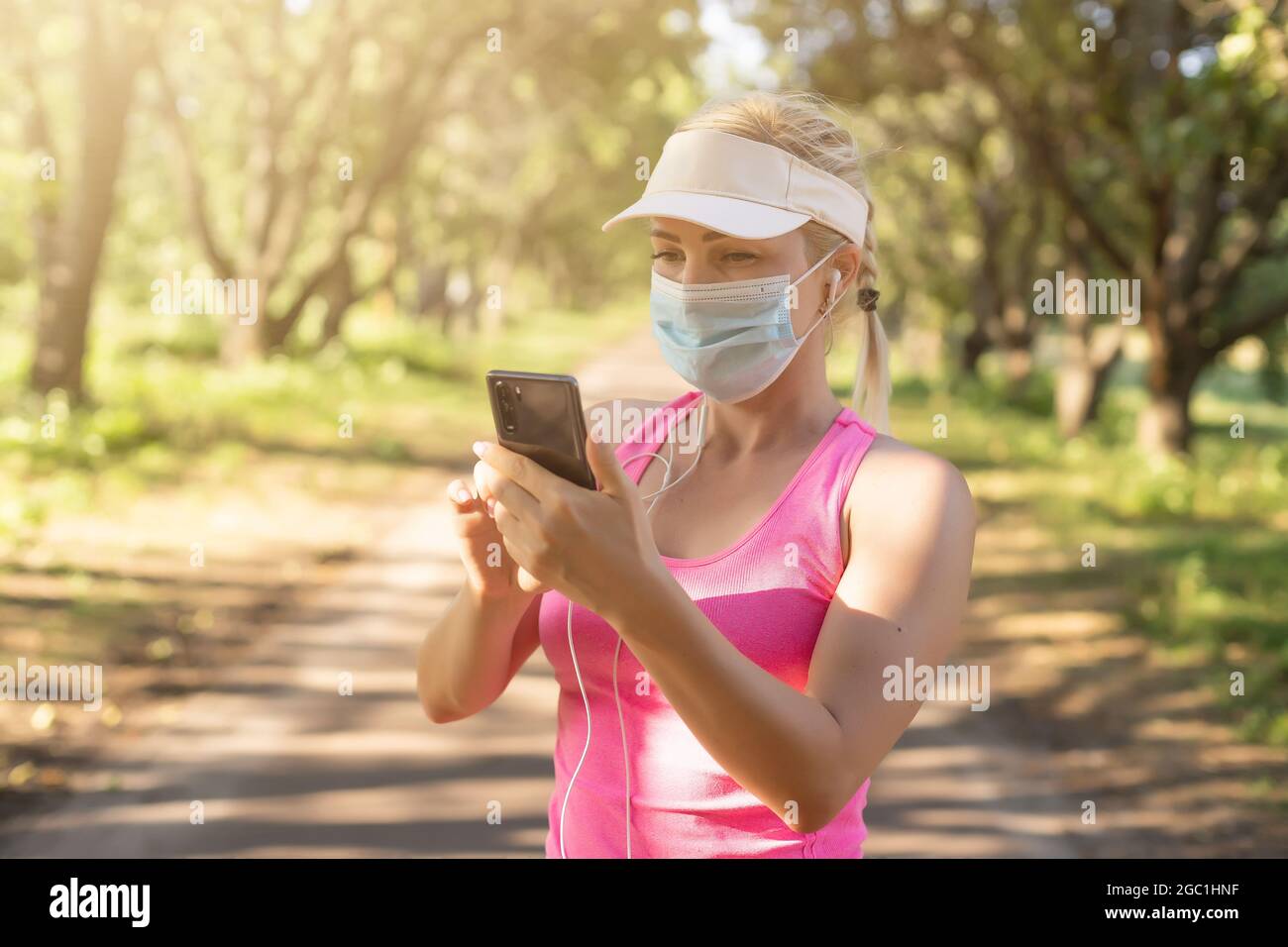 Stay in fit during quarantine. A sportive young woman is jogging ...