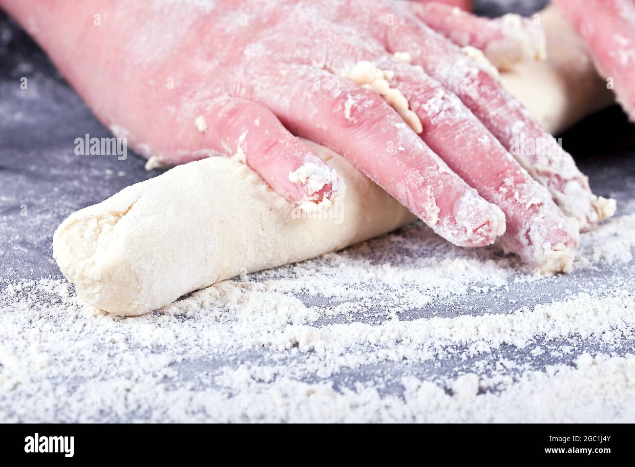 Manual kneading. Hands in flour Stock Photo - Alamy