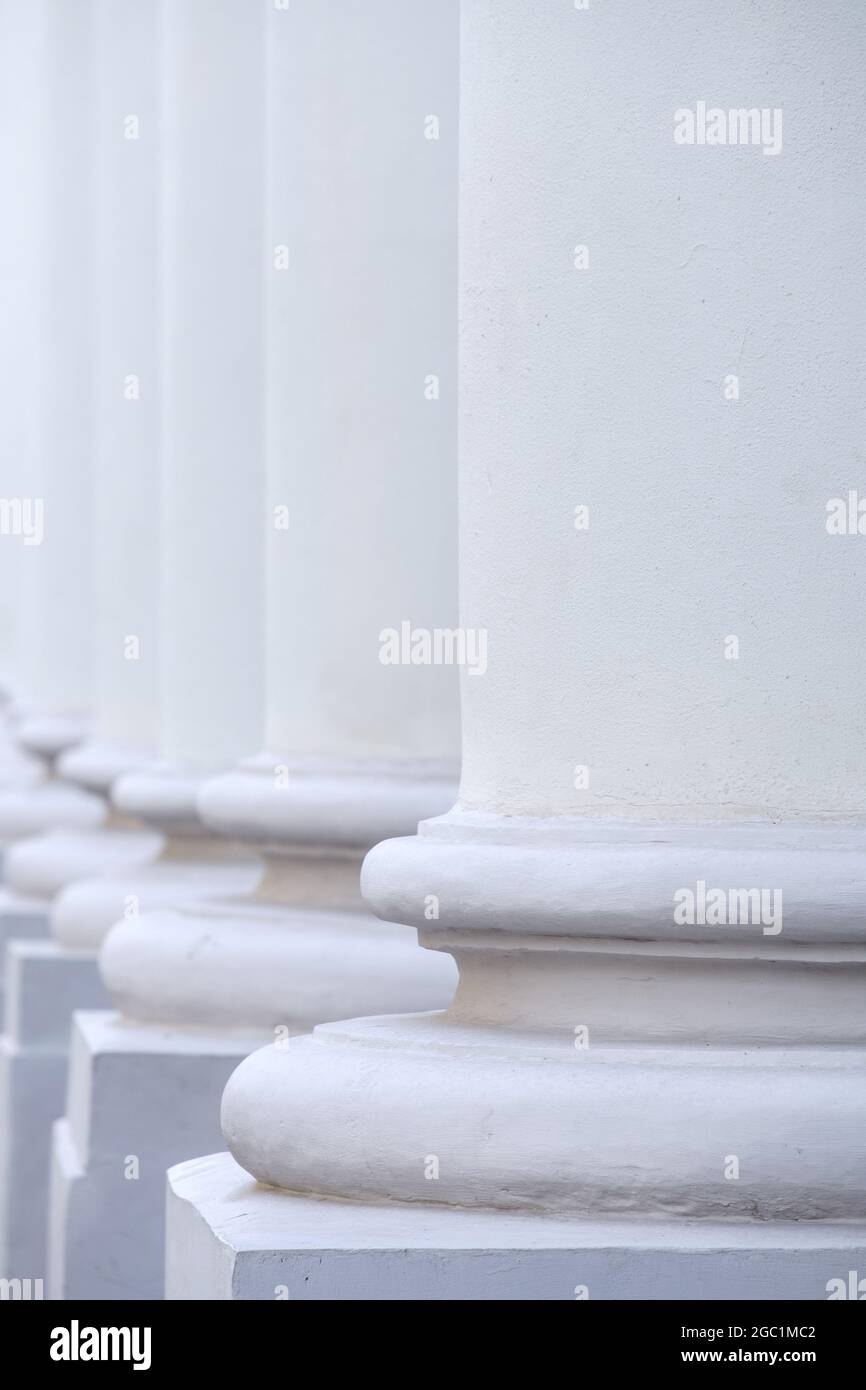 The base of the white ancient stone columns standing in a row ...
