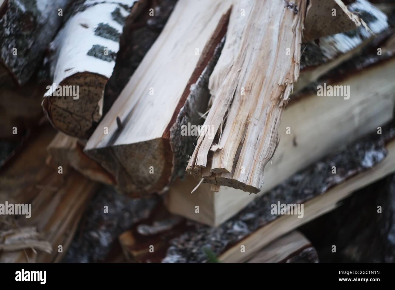 Firewood background - chopped firewood on a stack Stock Photo - Alamy