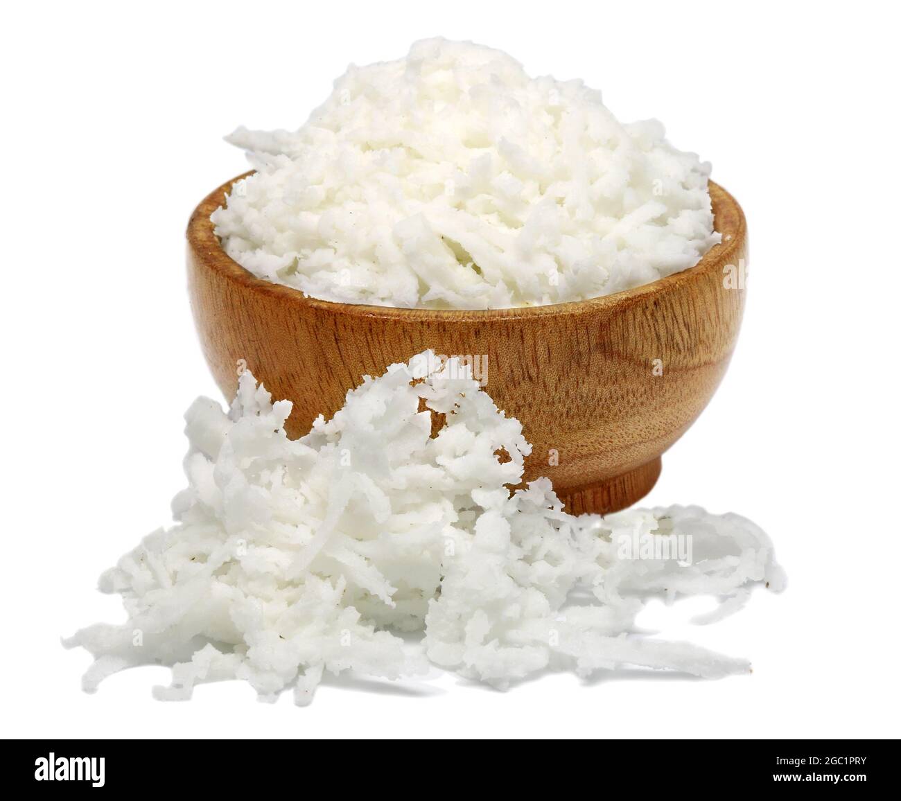 Fresh coconut flakes in wooden bowl on white background Stock Photo - Alamy