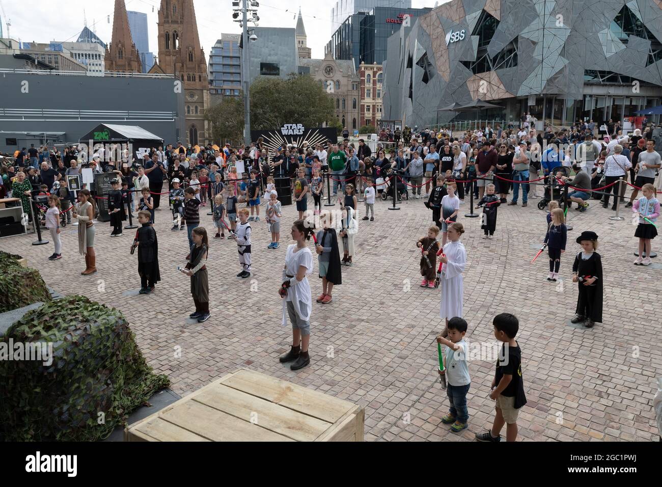 Childern line up for Light Sabre lessons during an early start to the ...