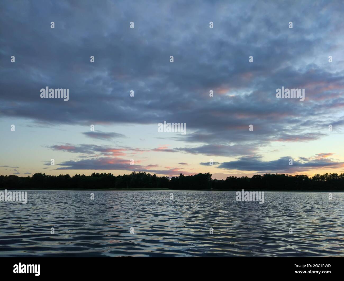 Calm lake surface at evening in Latvia, East Europe. summer sunset ...