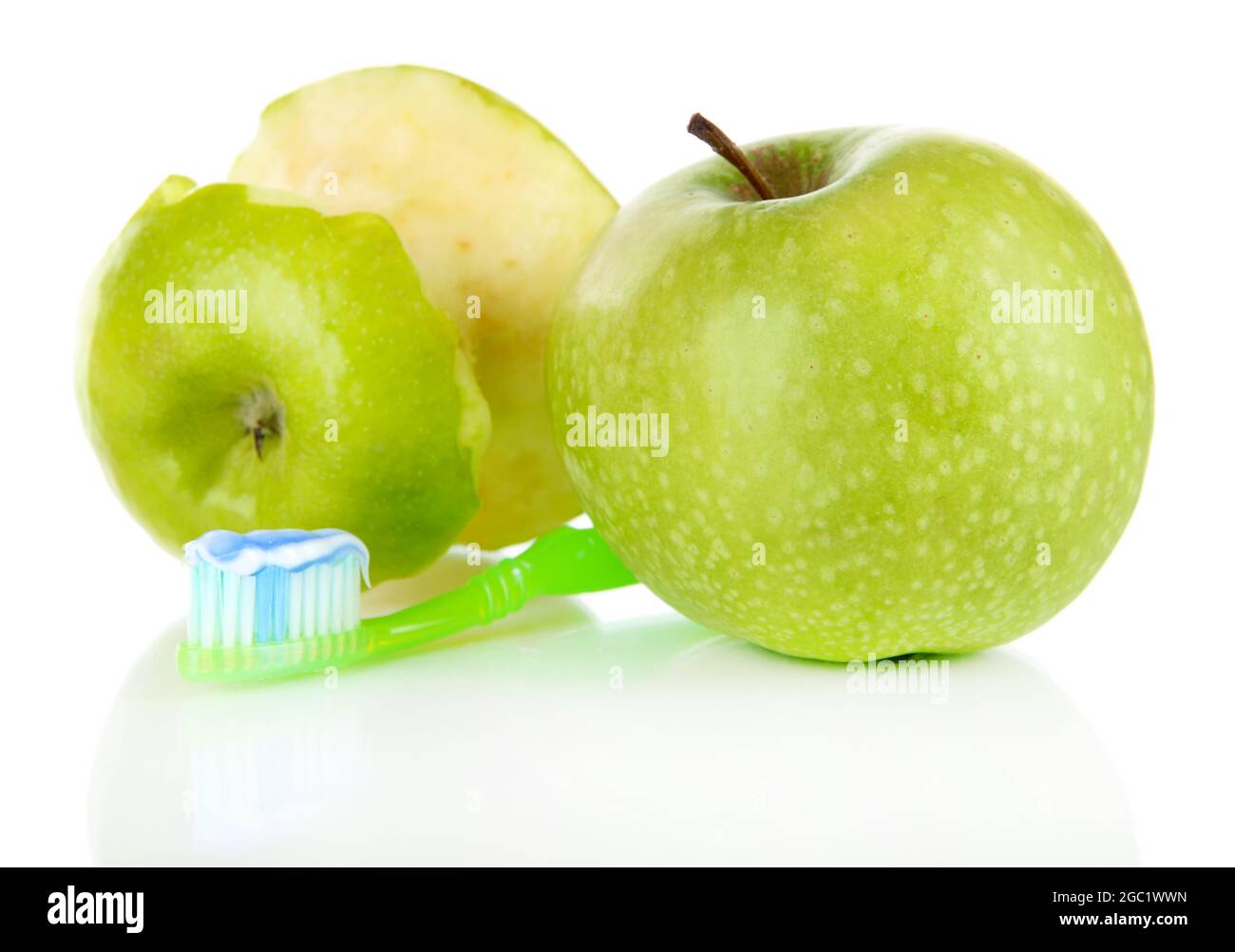 Apples with a toothbrush isolated on white Stock Photo - Alamy
