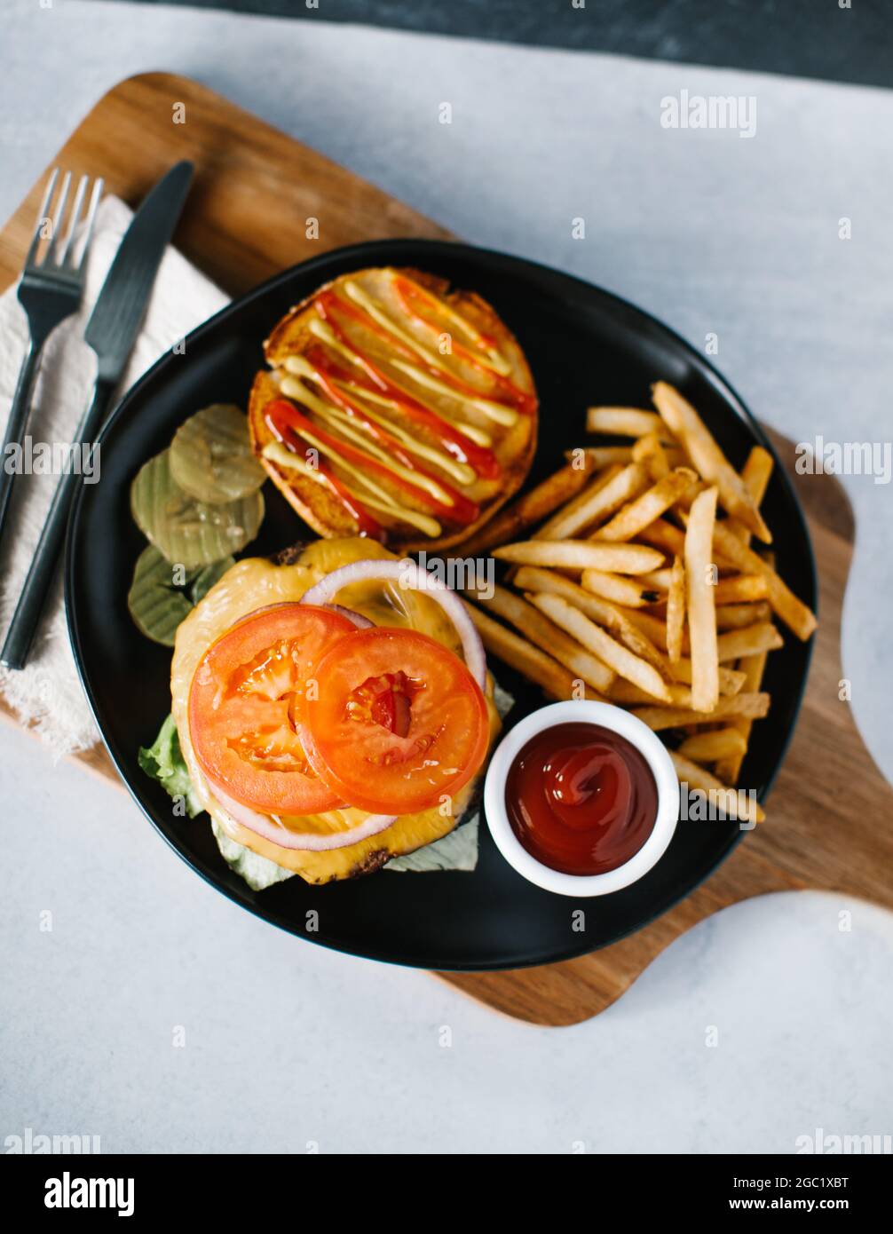 Top view of an open burger with fries Stock Photo - Alamy