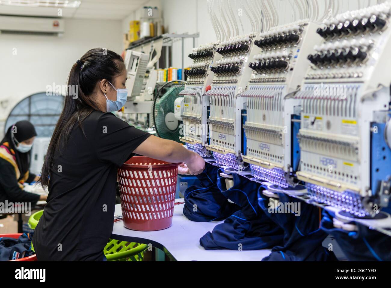 Kota Kinabalu, Sabah, Malaysia - April 09, 2021 : A worker are operate ...