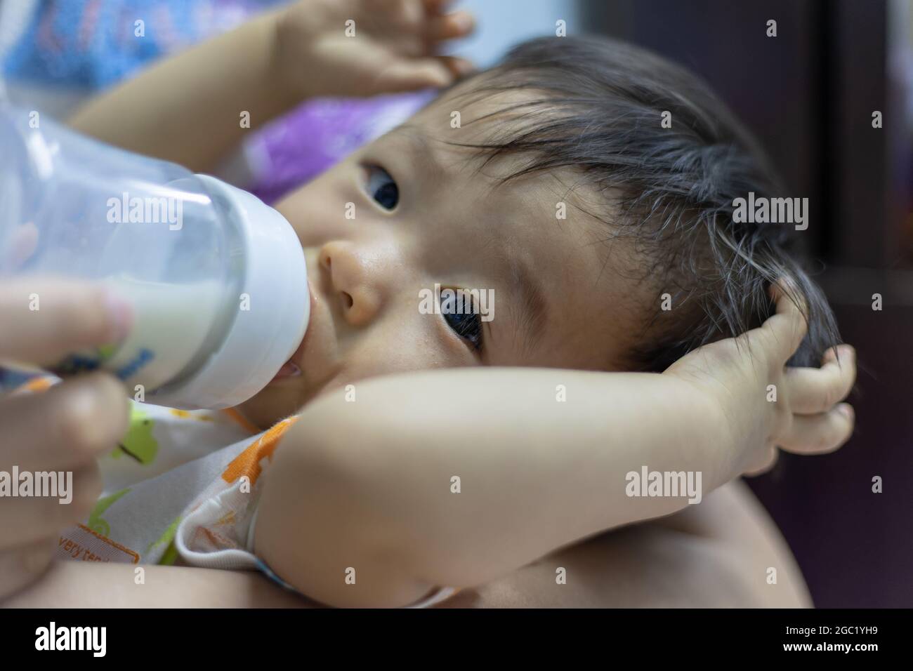 Asian Chinese baby boy drinking milk Stock Photo - Alamy