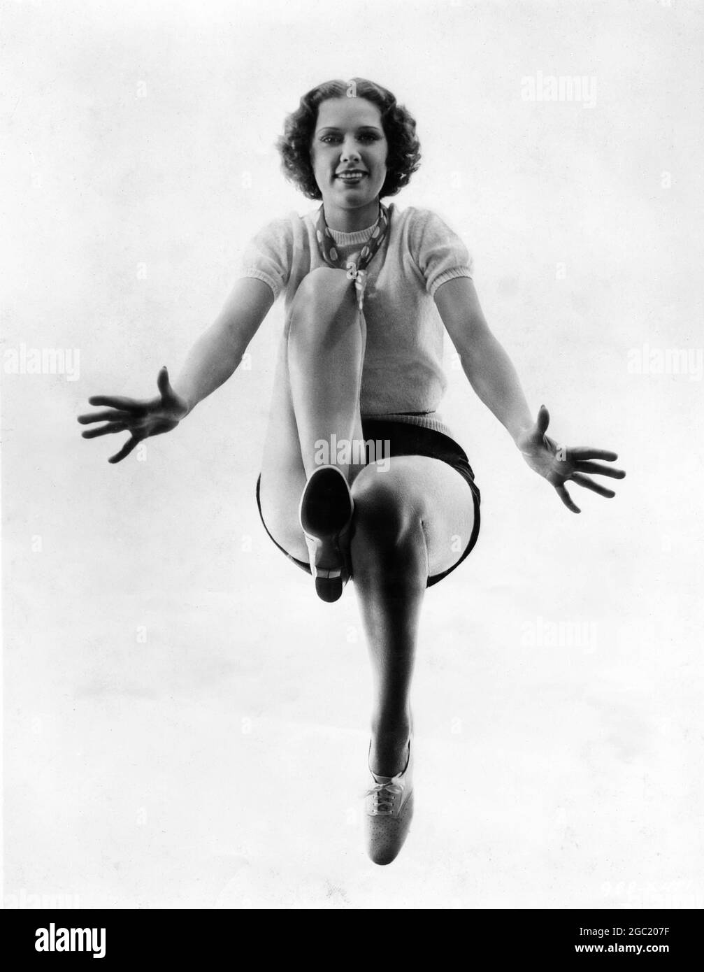 ELEANOR POWELL on set candid portrait from below during filming of ...
