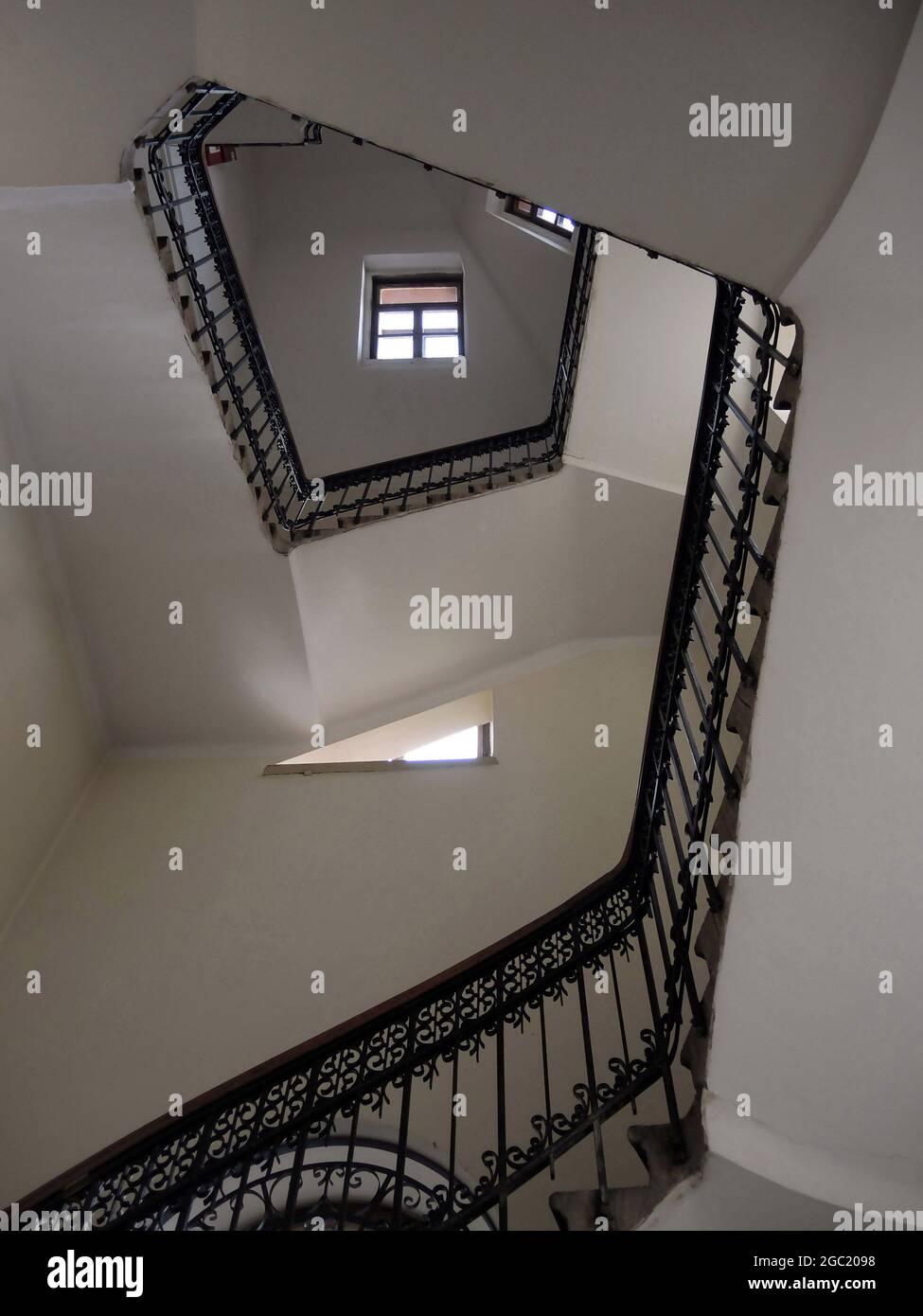 Vertical shot of a staircase up to the ceiling Stock Photo - Alamy