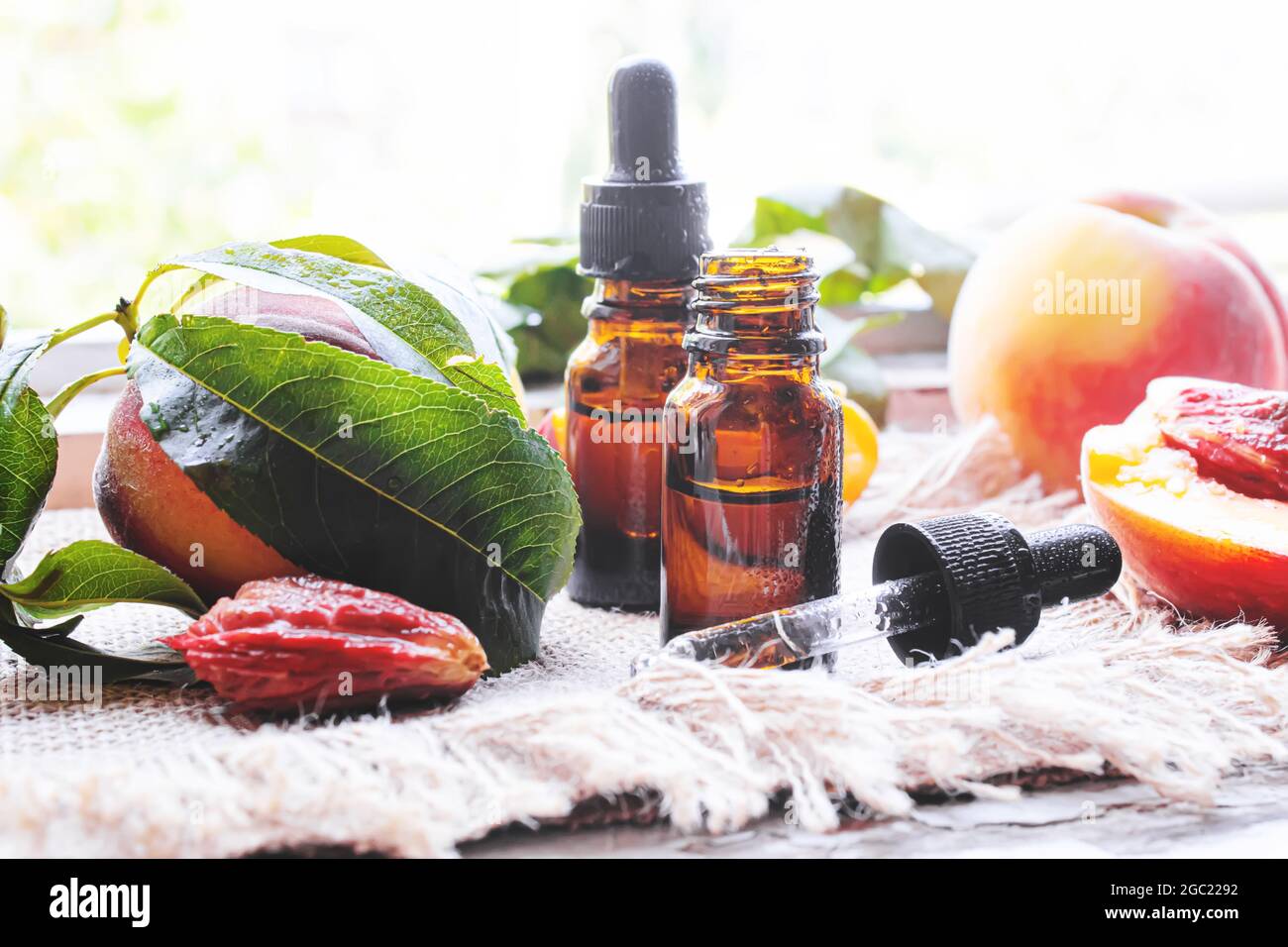Peach seed oil in a bottle. Selective focus.food Stock Photo - Alamy