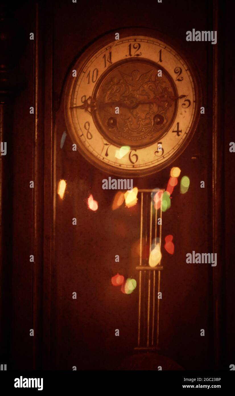 Vintage wooden clock hanging on the wall Stock Photo - Alamy