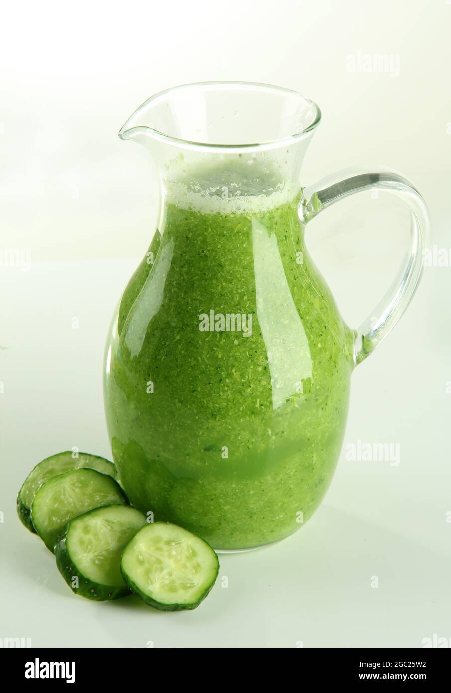 Glass pitcher of cucumber juice isolated on white Stock Photo - Alamy