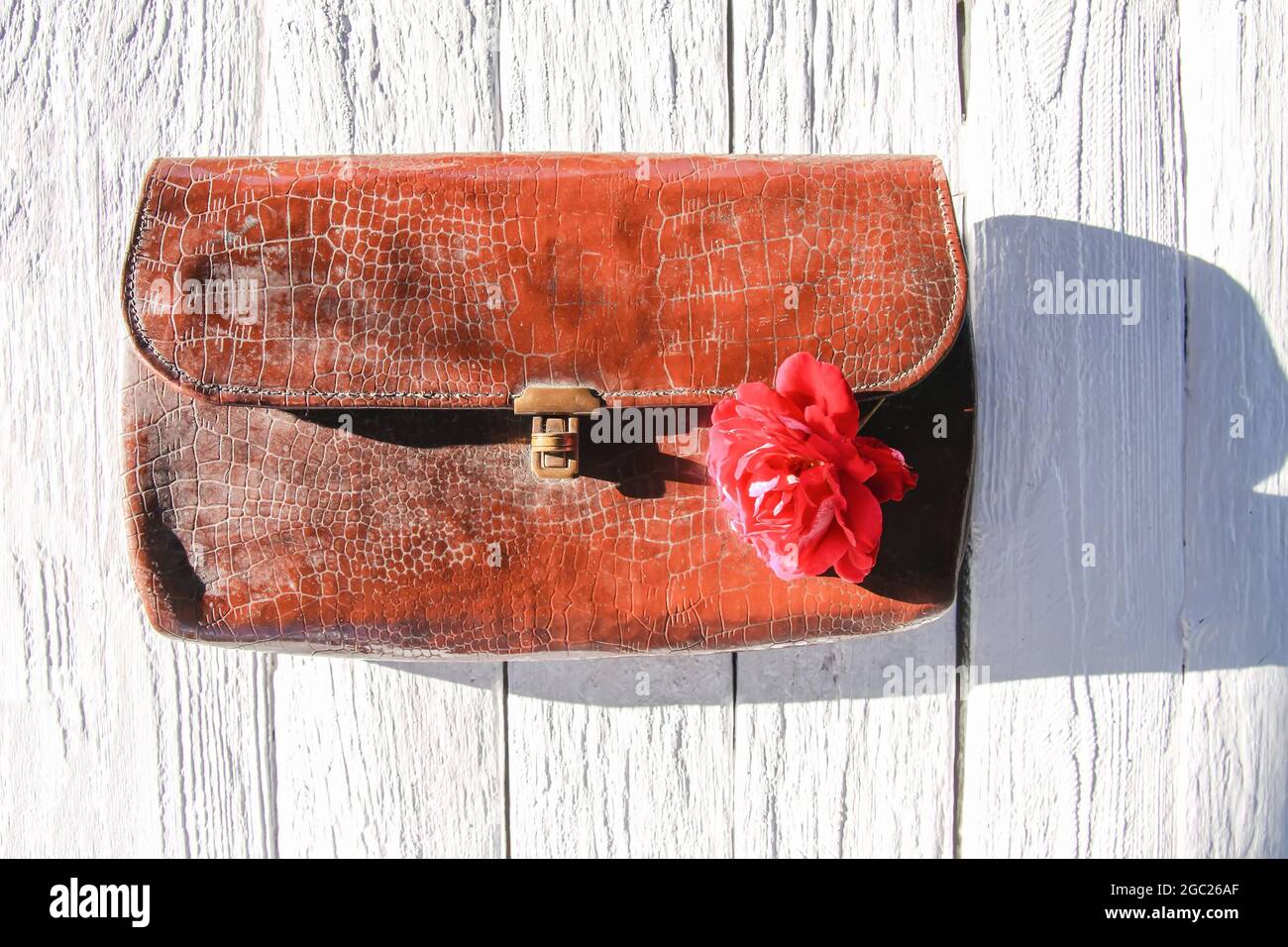 Old leather vintage reticule bag with rose Stock Photo - Alamy