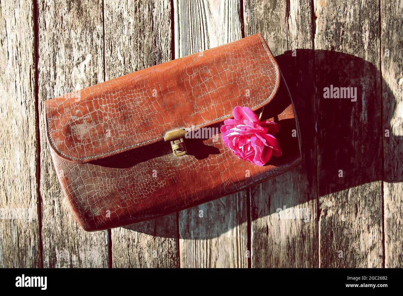 Old leather vintage reticule bag with rose Stock Photo - Alamy
