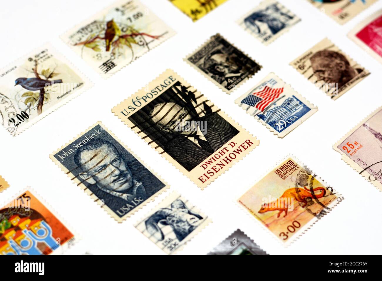 background of various old used postage stamps from different countries ...