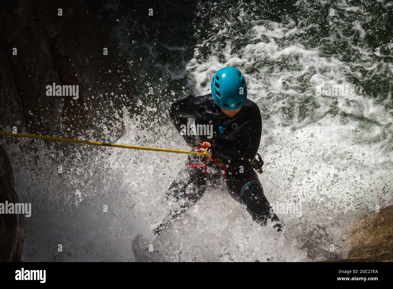 Rafter in a river with water splashes everywhere in Corsica, France ...