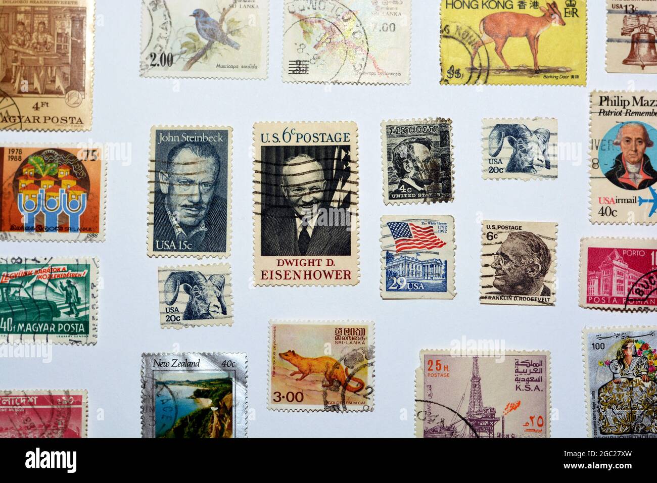 background of various old used postage stamps from different countries ...
