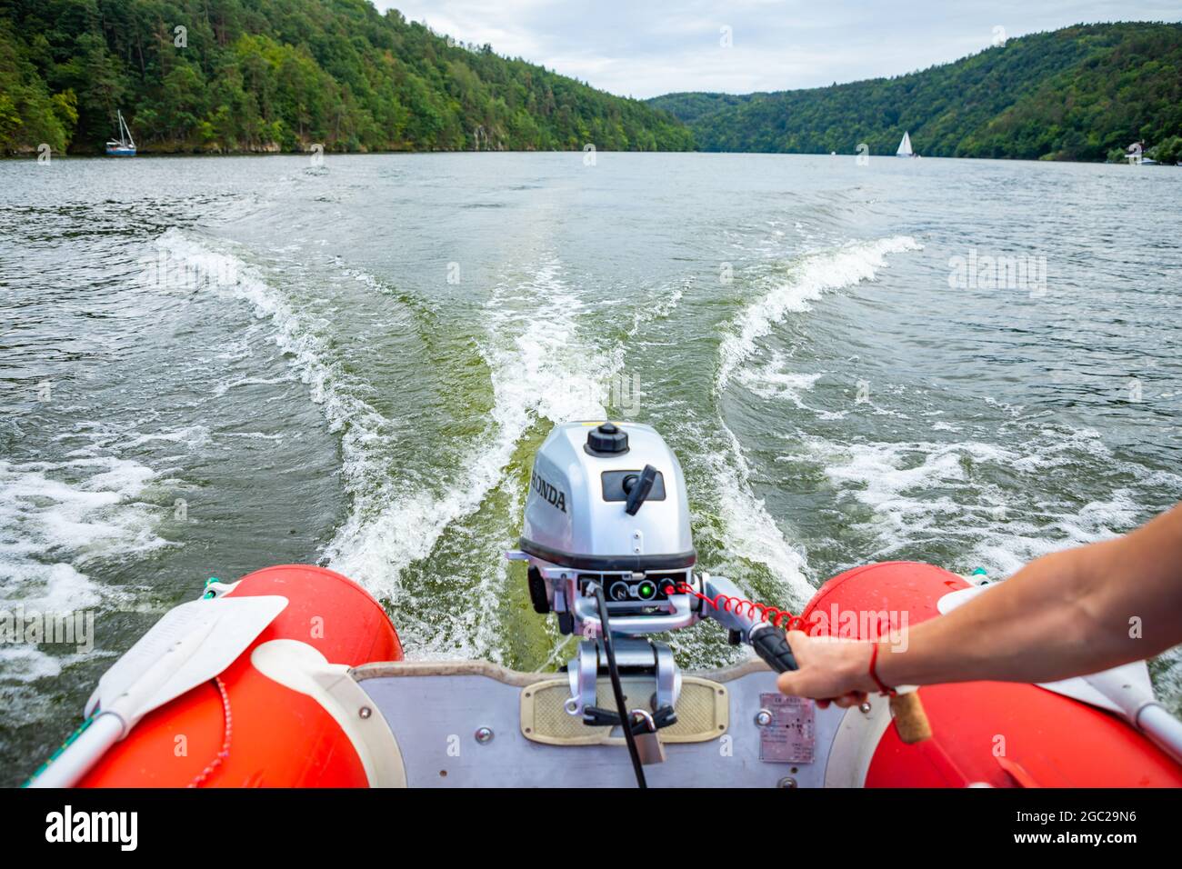 Boat driver's hand on the wheel of motor close up on river, Czech ...