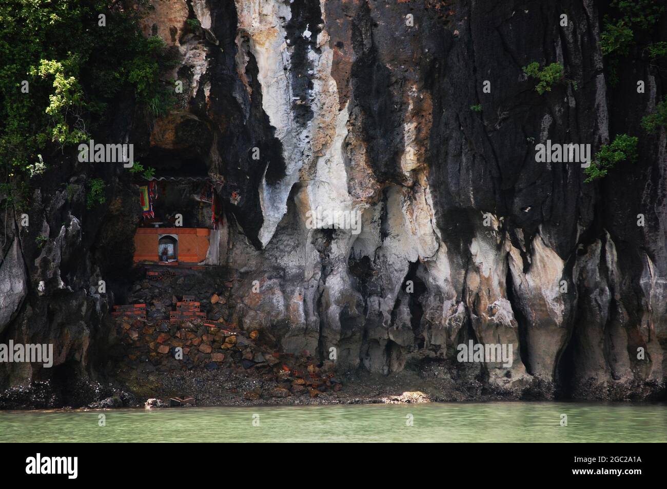 Small shrine in limestone cave for vietnamese people and foreign ...
