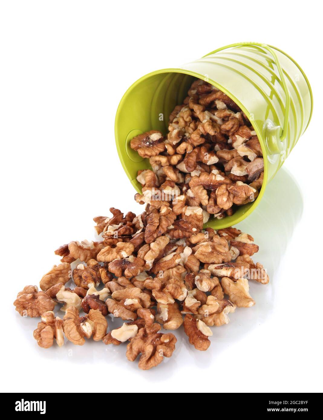 Overturned bucket with nuts isolated on white Stock Photo - Alamy
