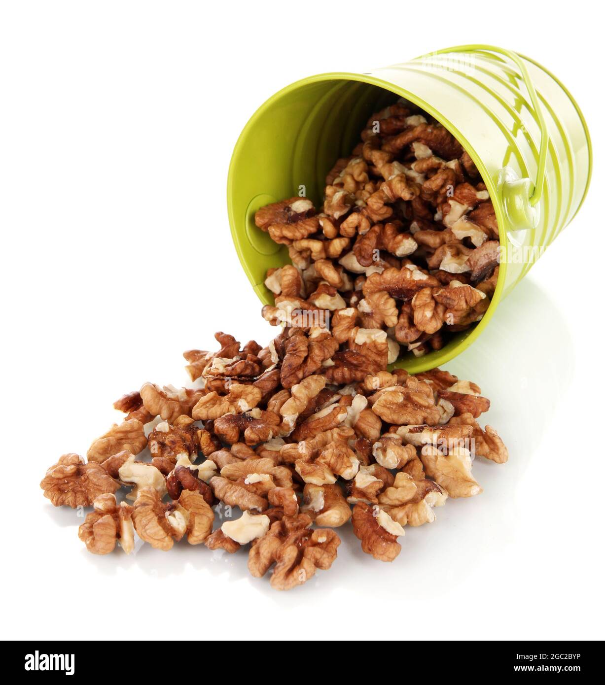 Overturned bucket with nuts isolated on white Stock Photo - Alamy