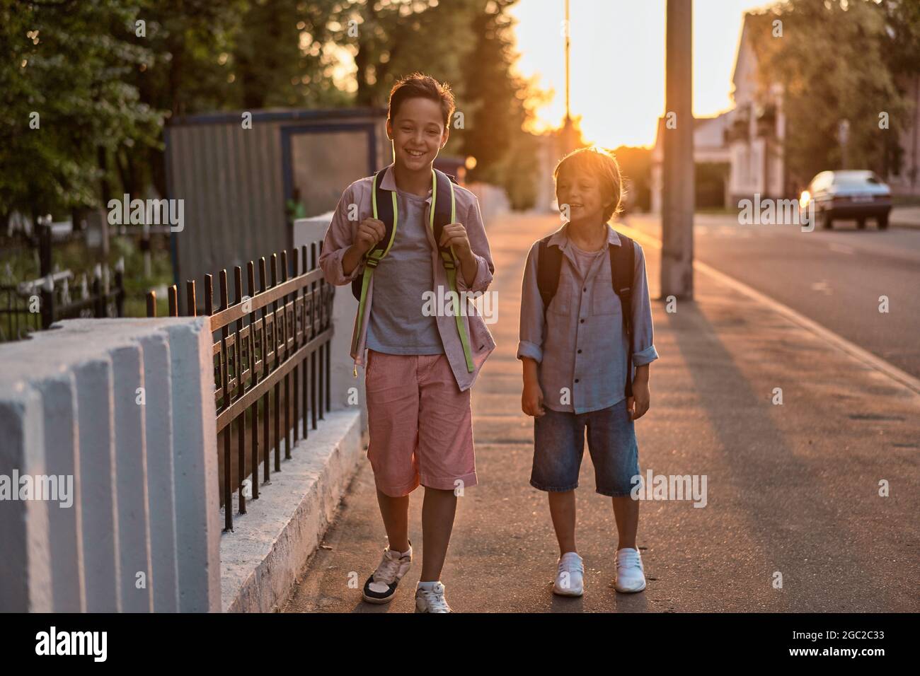 School boys running to school. School boys having fun after school ...