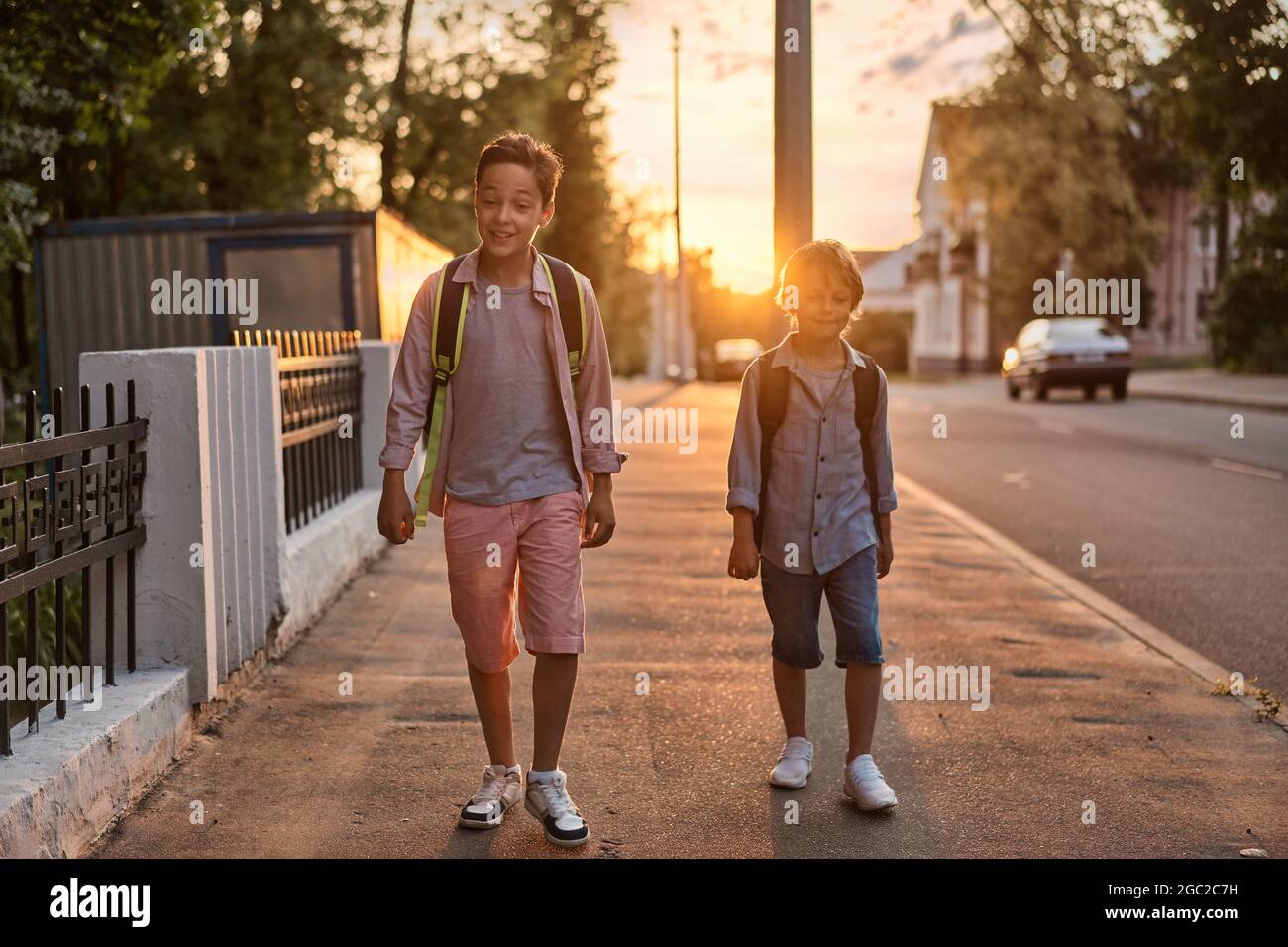 School boys running to school. School boys having fun after school ...