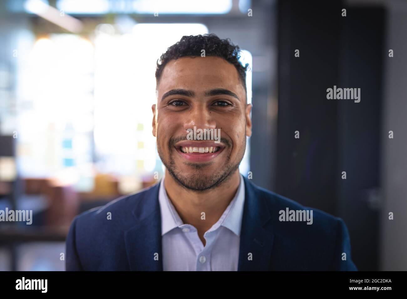Portrait of smiling mixed race businessman looking at camera Stock ...