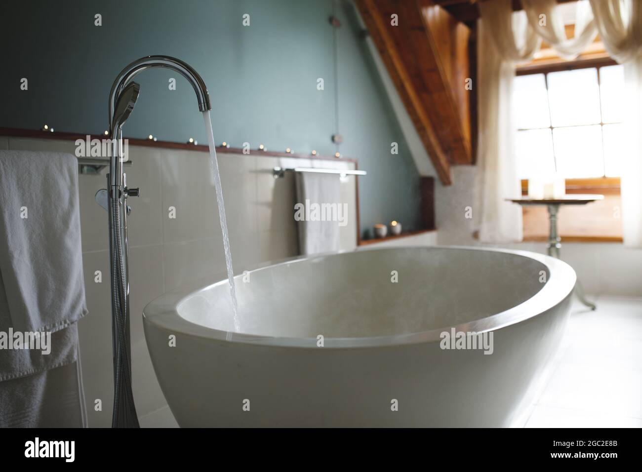 Interior of luxury bathroom and bath with running water Stock Photo - Alamy