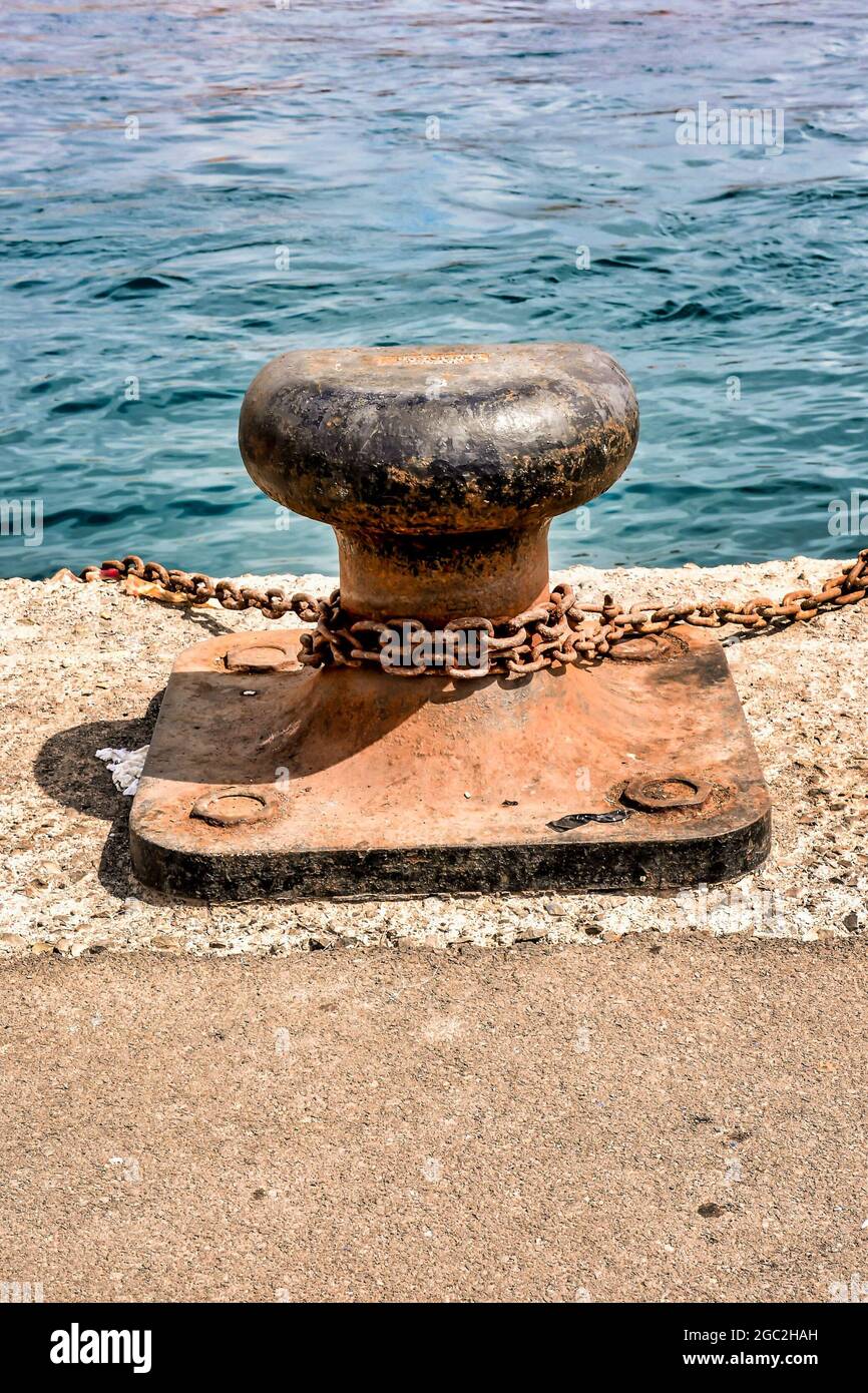 Old rusty bollard at the harbor Stock Photo - Alamy
