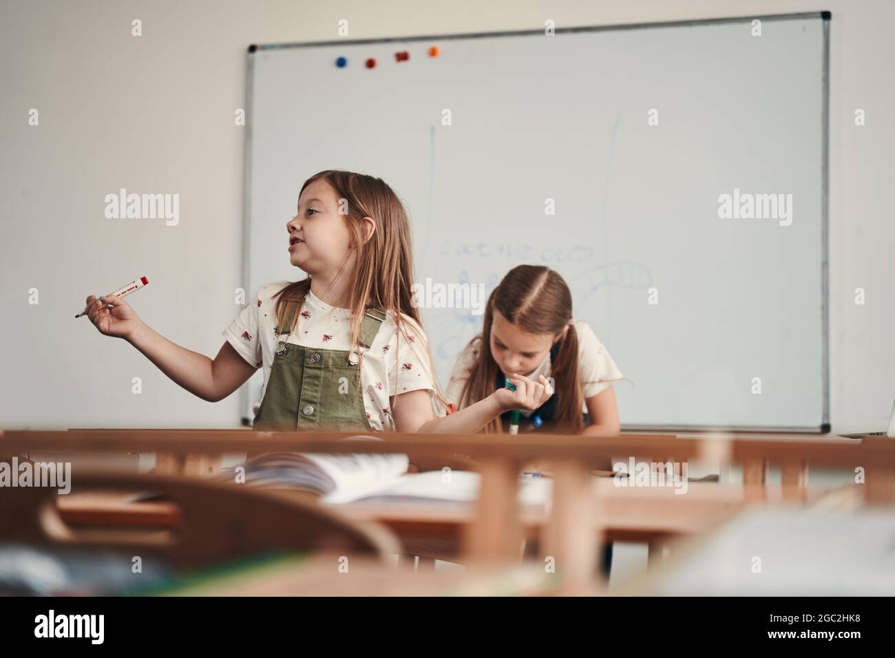 Sharing ideas with classmates while doing tasks Stock Photo - Alamy