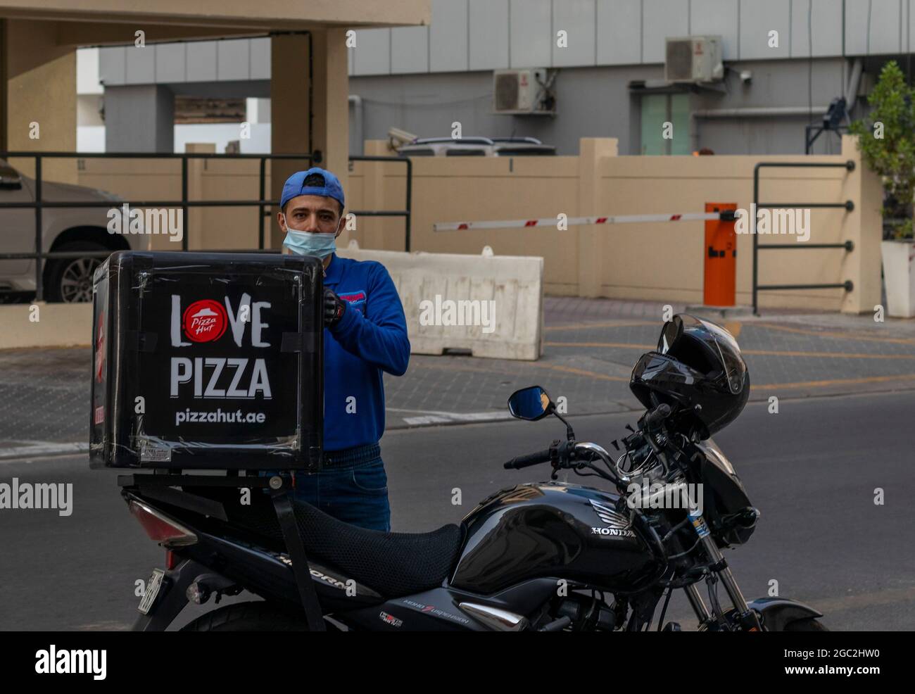 Dubai, UAE - 08.03.2021 - Delivery boy in Deira area Stock Photo - Alamy