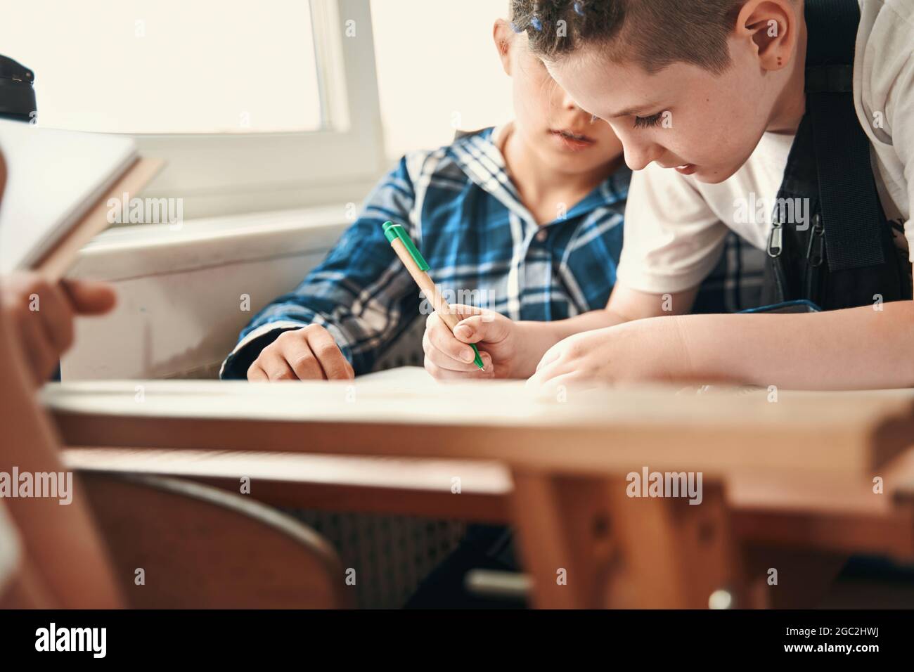 Making notes at the lesson during the group work Stock Photo - Alamy