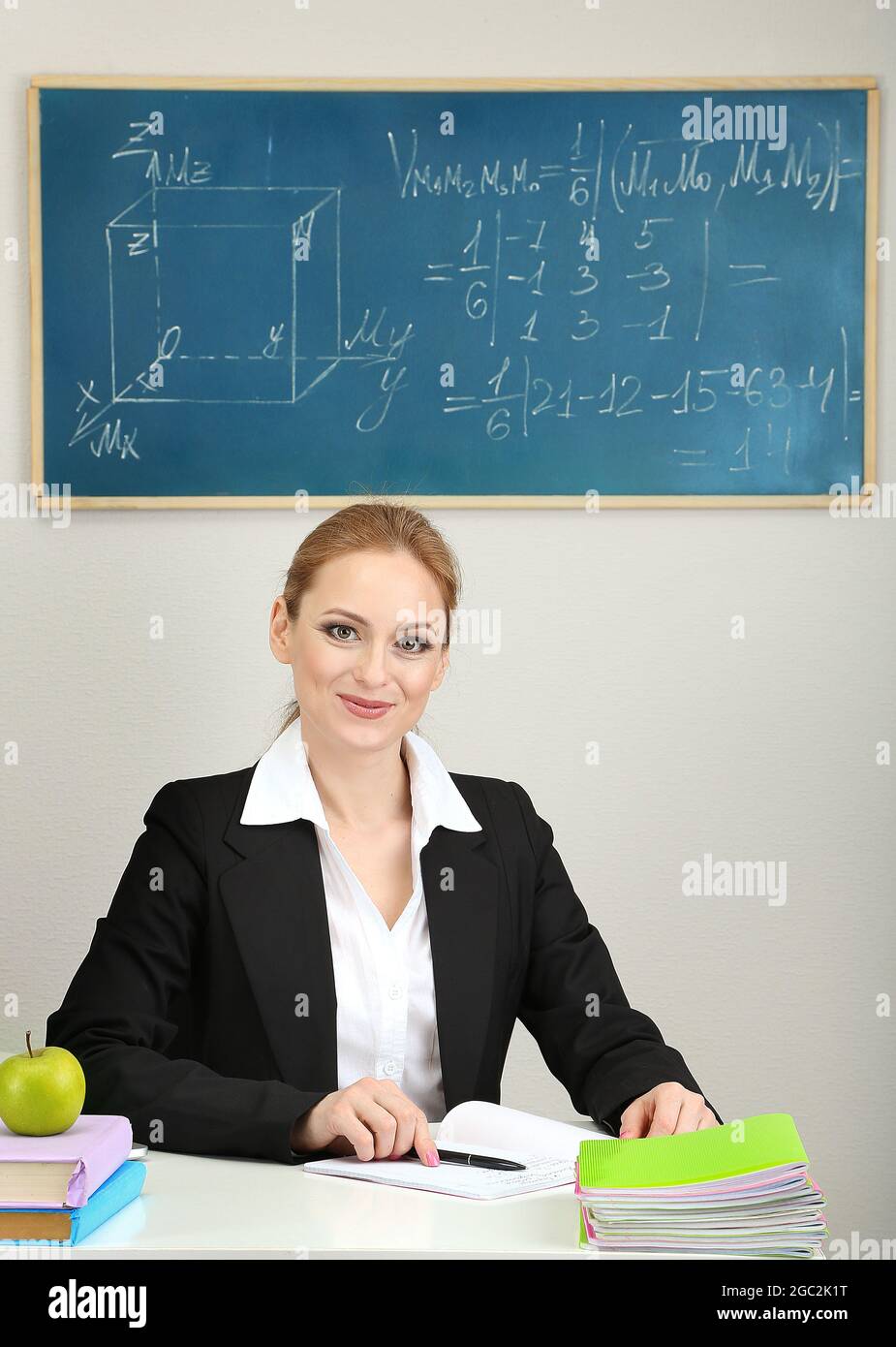 Portrait of teacher woman working in classroom Stock Photo - Alamy