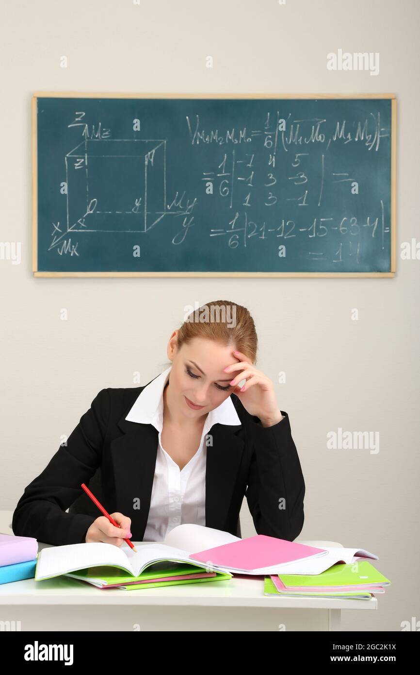 Portrait of teacher woman working in the classroom Stock Photo - Alamy