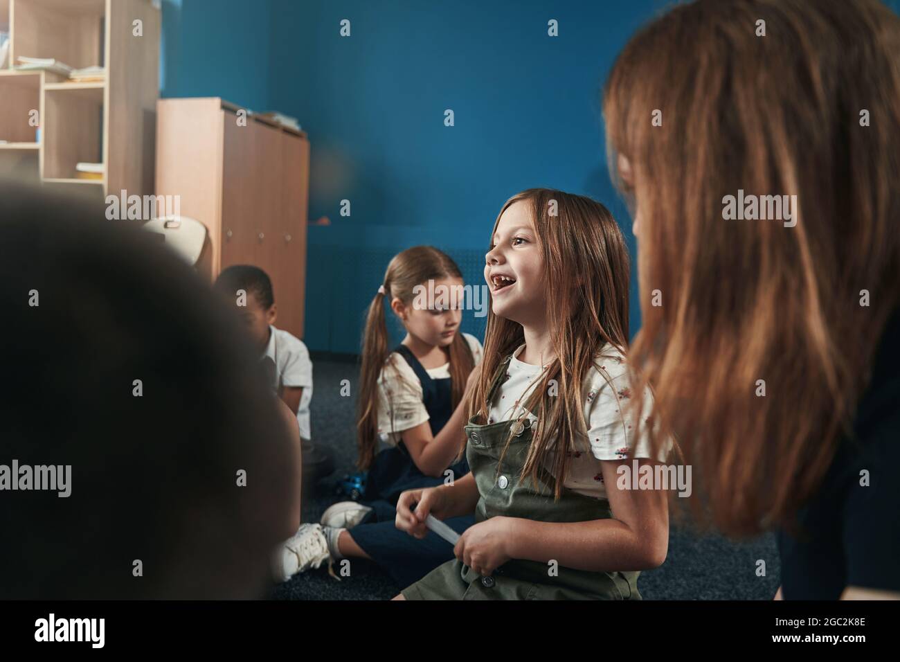 Informal Lesson On The Floor For Elementary Kids Stock Photo Alamy