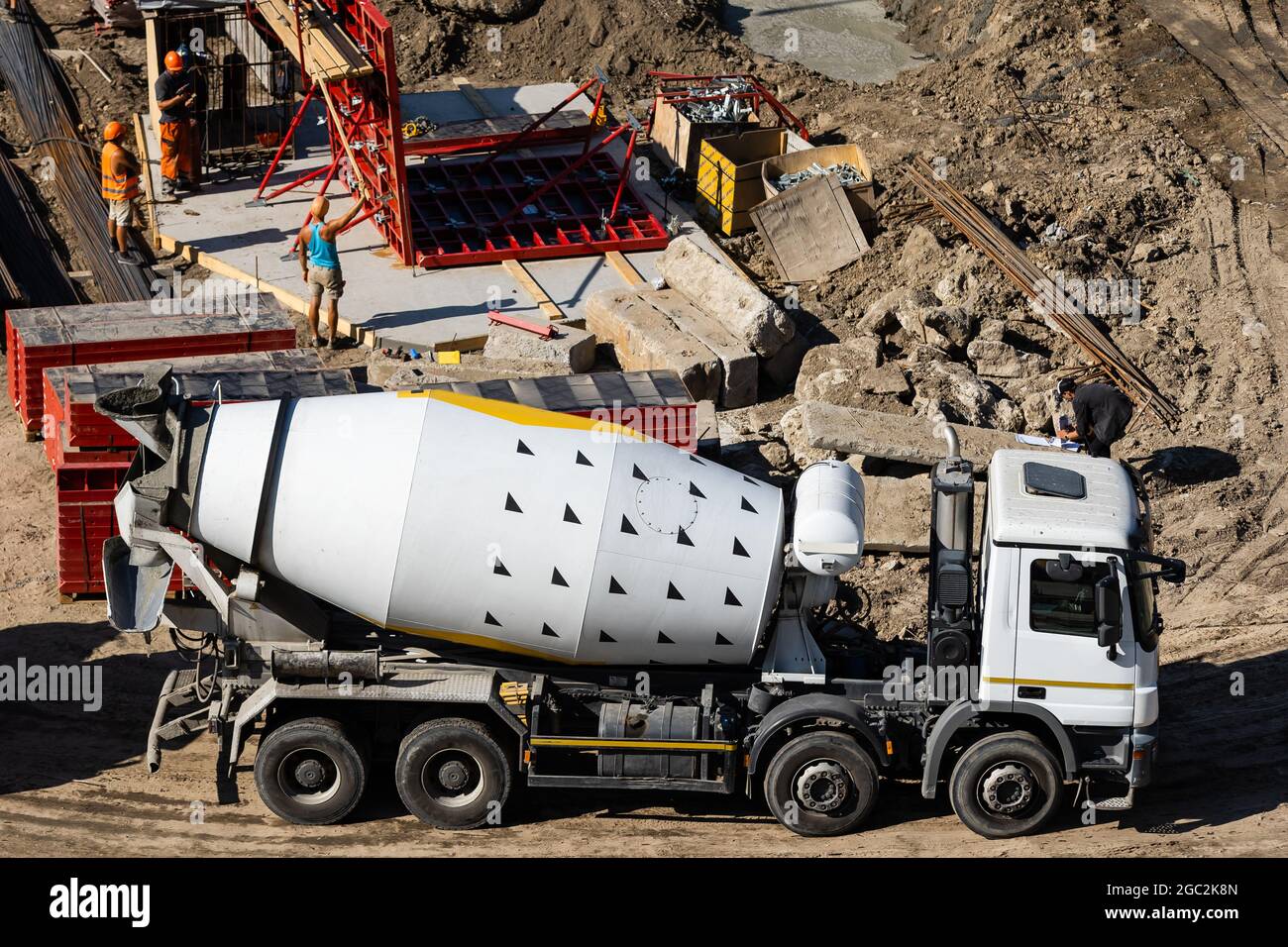 Huge construction site with a lot of construction equipment, houses ...