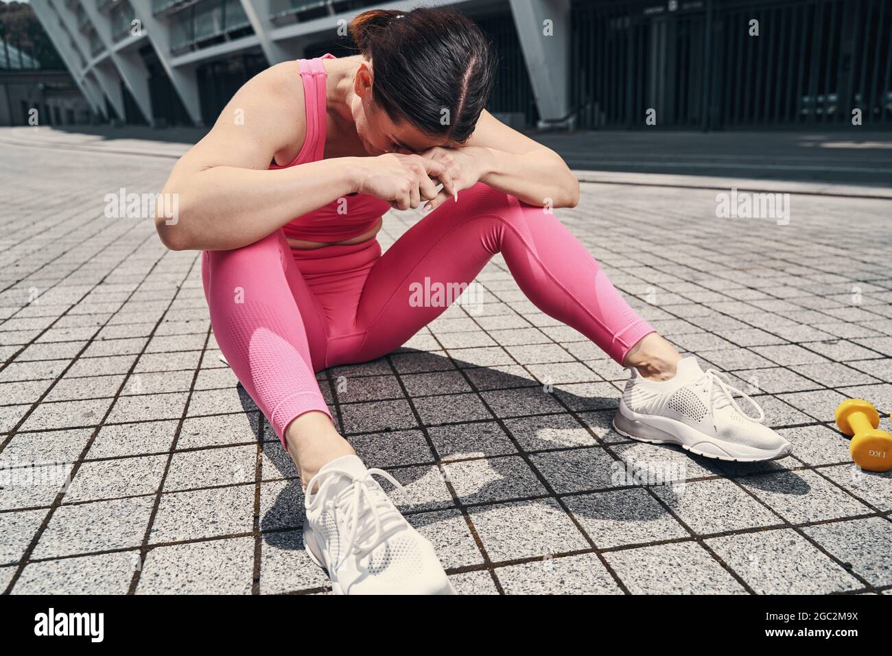 Female covering her face while having a laugh after exercise Stock ...