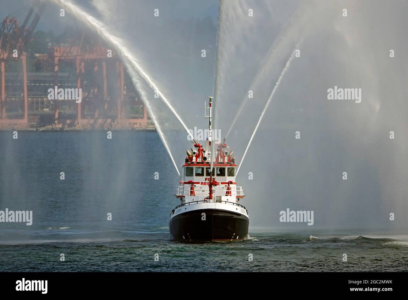 Seattle, Washington Harbor, Puget Sound, 2021. A fireboat shows off its ...