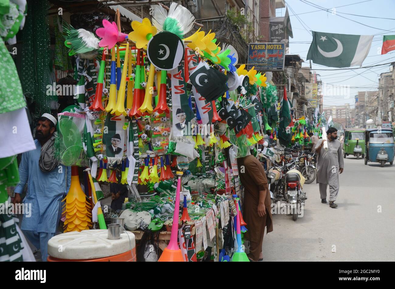 Peshawar, Pakistan. 06th Aug, 2021. A Pakistani vendor sells National ...