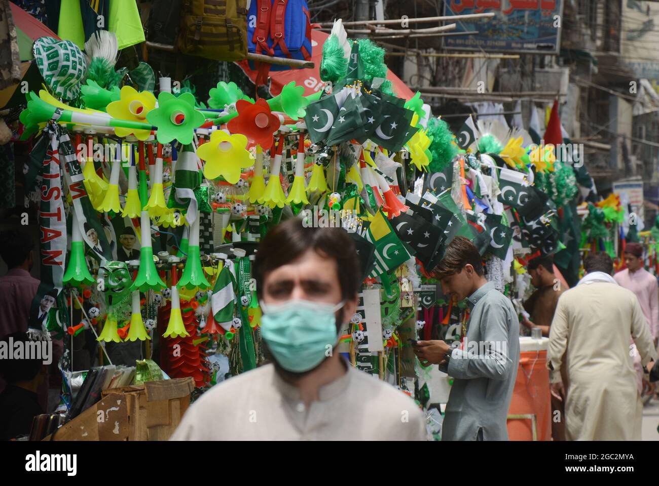 Peshawar, Pakistan. 06th Aug, 2021. A Pakistani vendor sells National ...