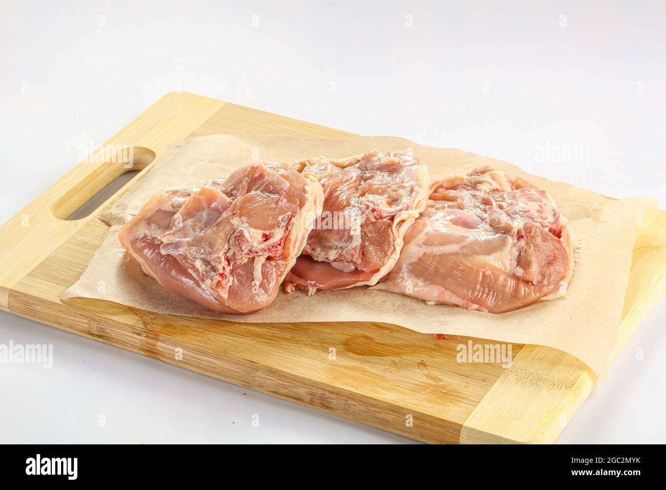 Raw chicken leg fillet uncooked over board Stock Photo - Alamy